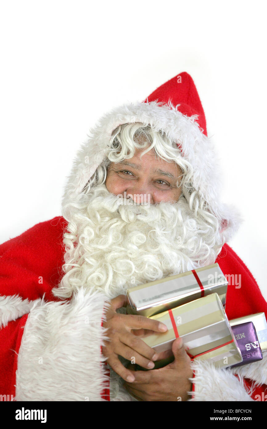 Father Christmas with arms full of presents Stock Photo - Alamy