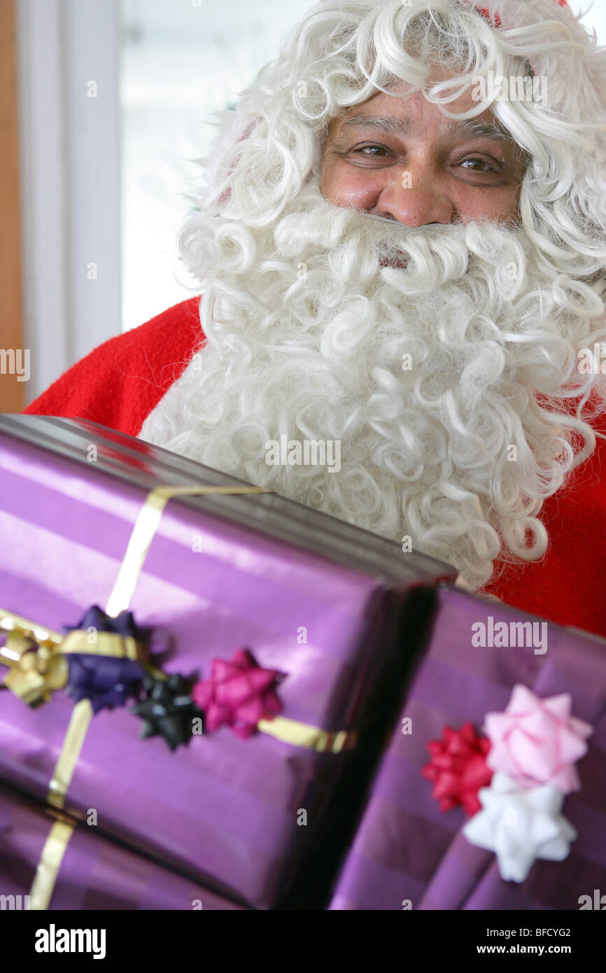 Santa Claus with gifts Stock Photo - Alamy