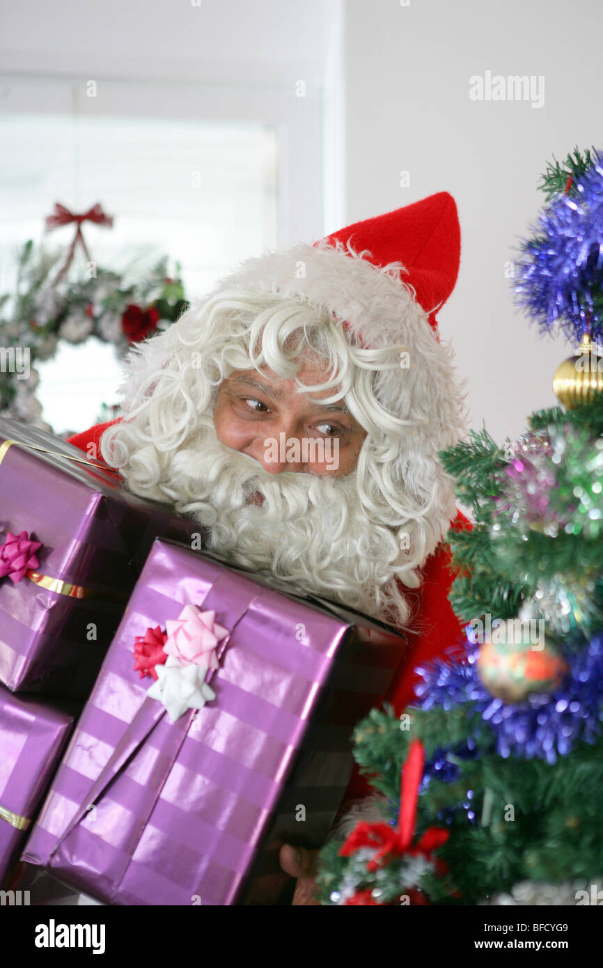 Santa Claus with gifts Stock Photo - Alamy