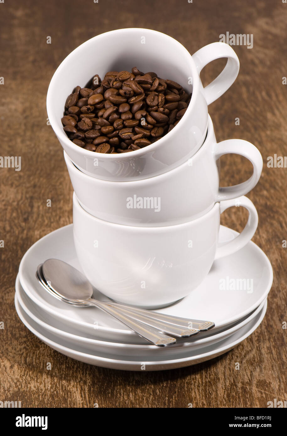 Stack of coffee cups with beans inside Stock Photo - Alamy