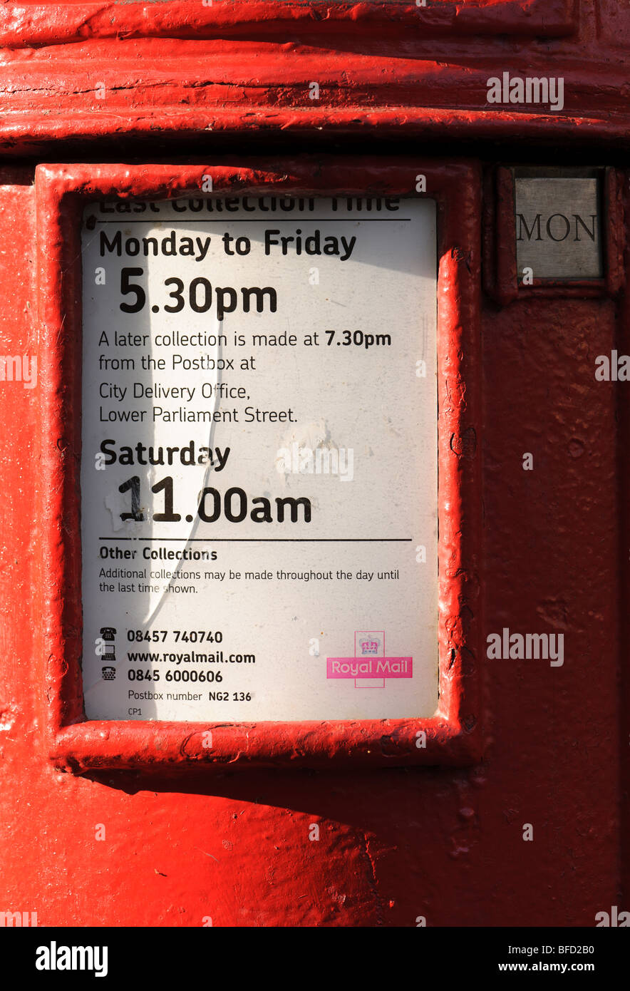 Damaged sign notice on a red Royal Mail pillar box post box showing ...