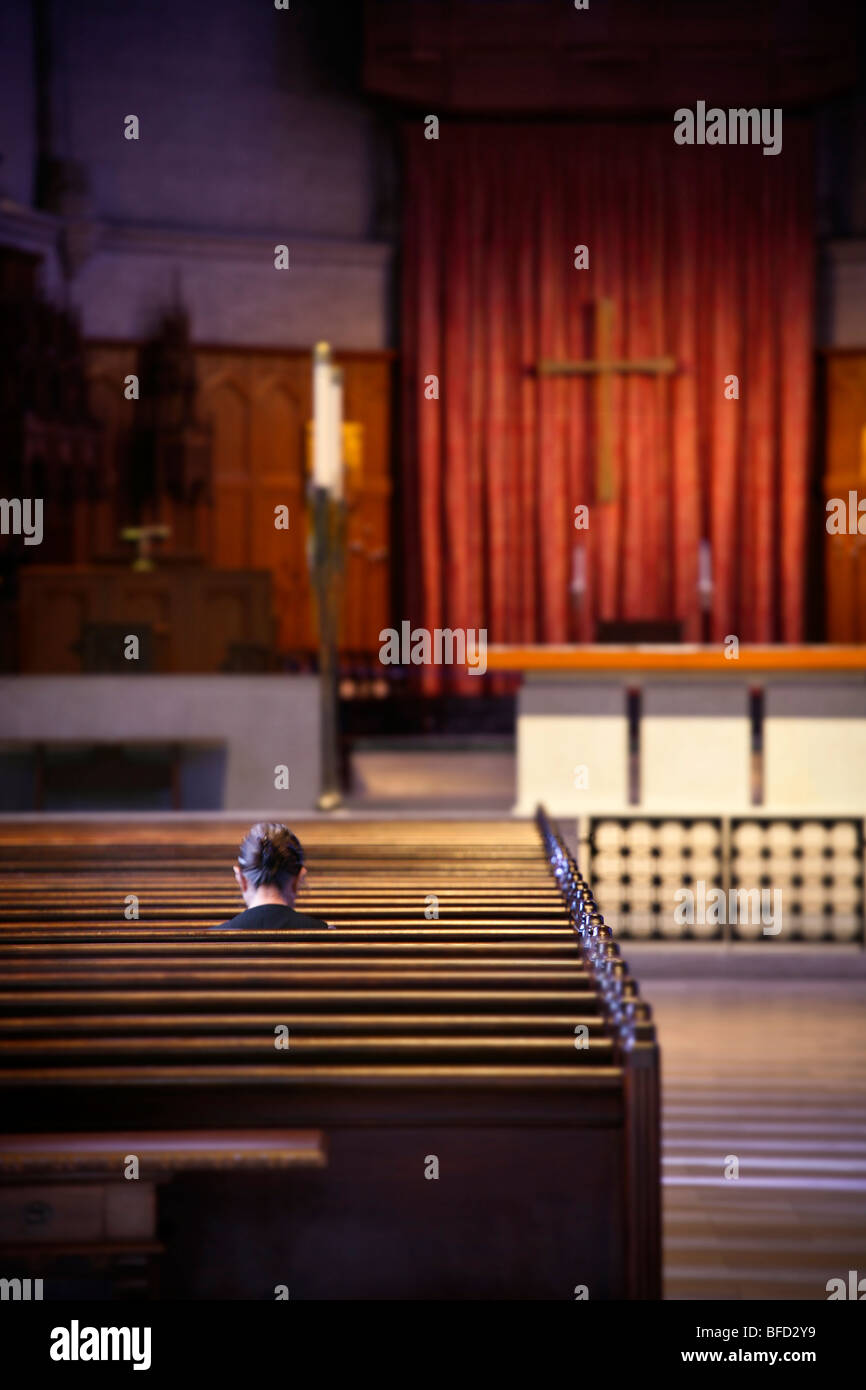 Praying in church Stock Photo - Alamy