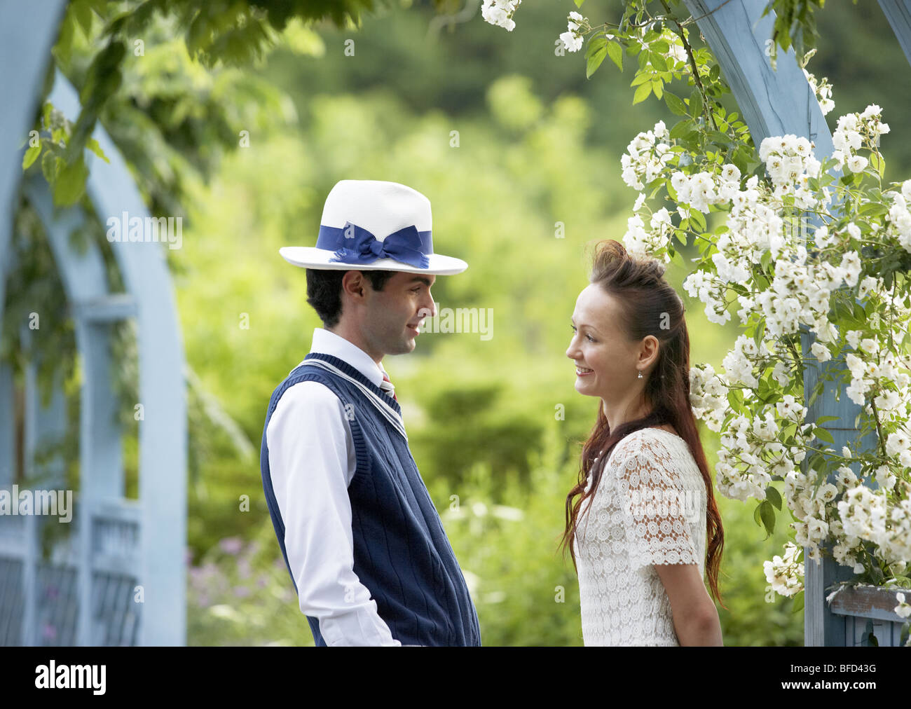 Couple facing each other Stock Photo - Alamy