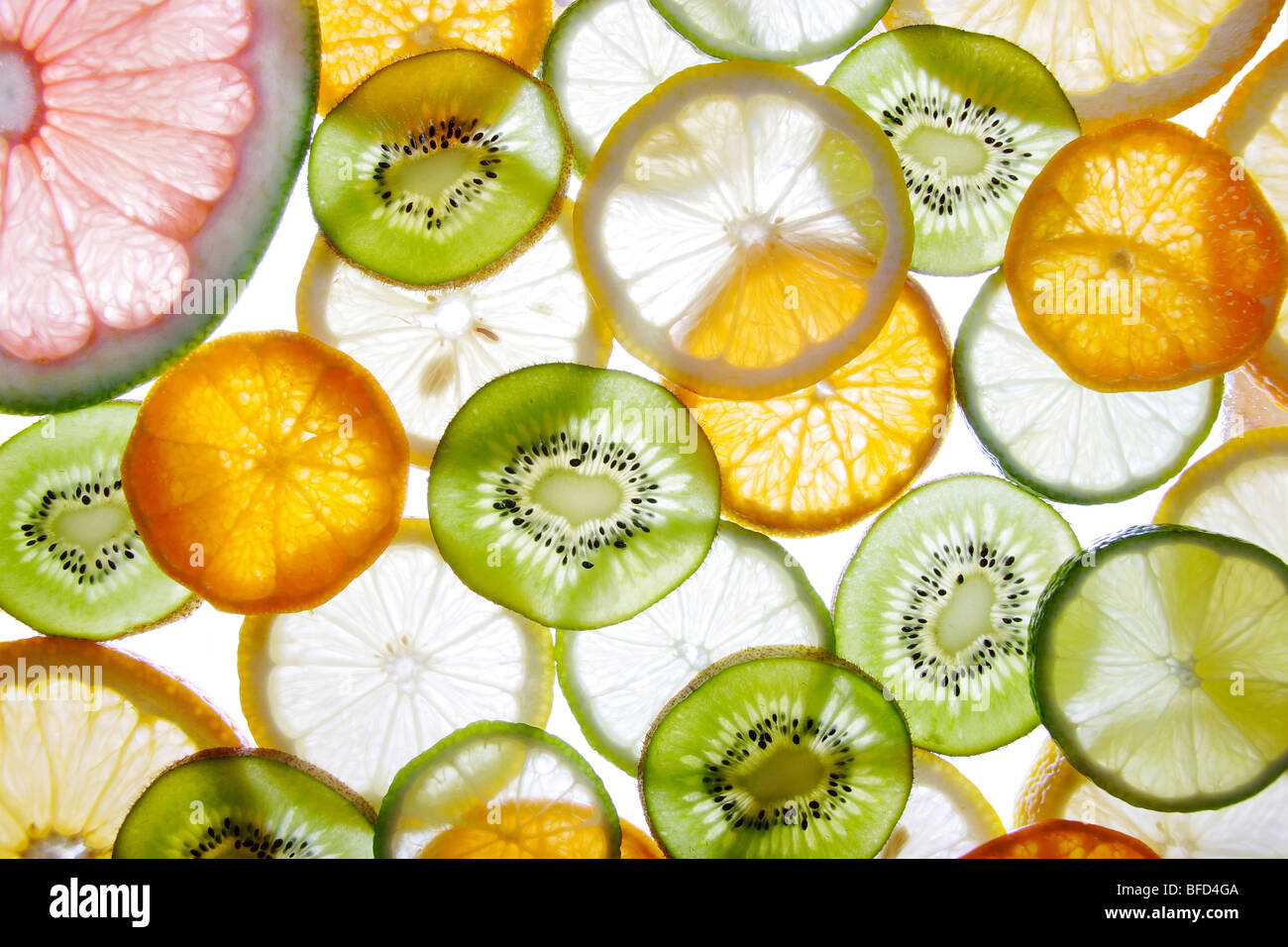 Brighten citrus slices on a white background Stock Photo - Alamy