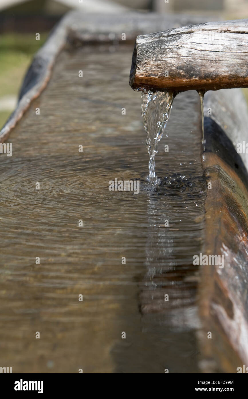 Fresh mountain spring water, traditional drinking fountain and trough ...
