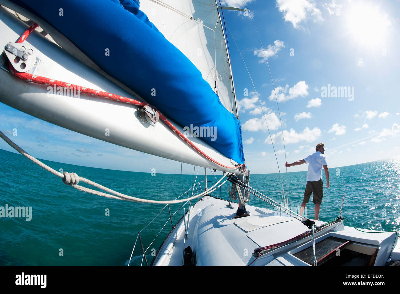 A man stands on a boat off of Florida Stock Photo - Alamy