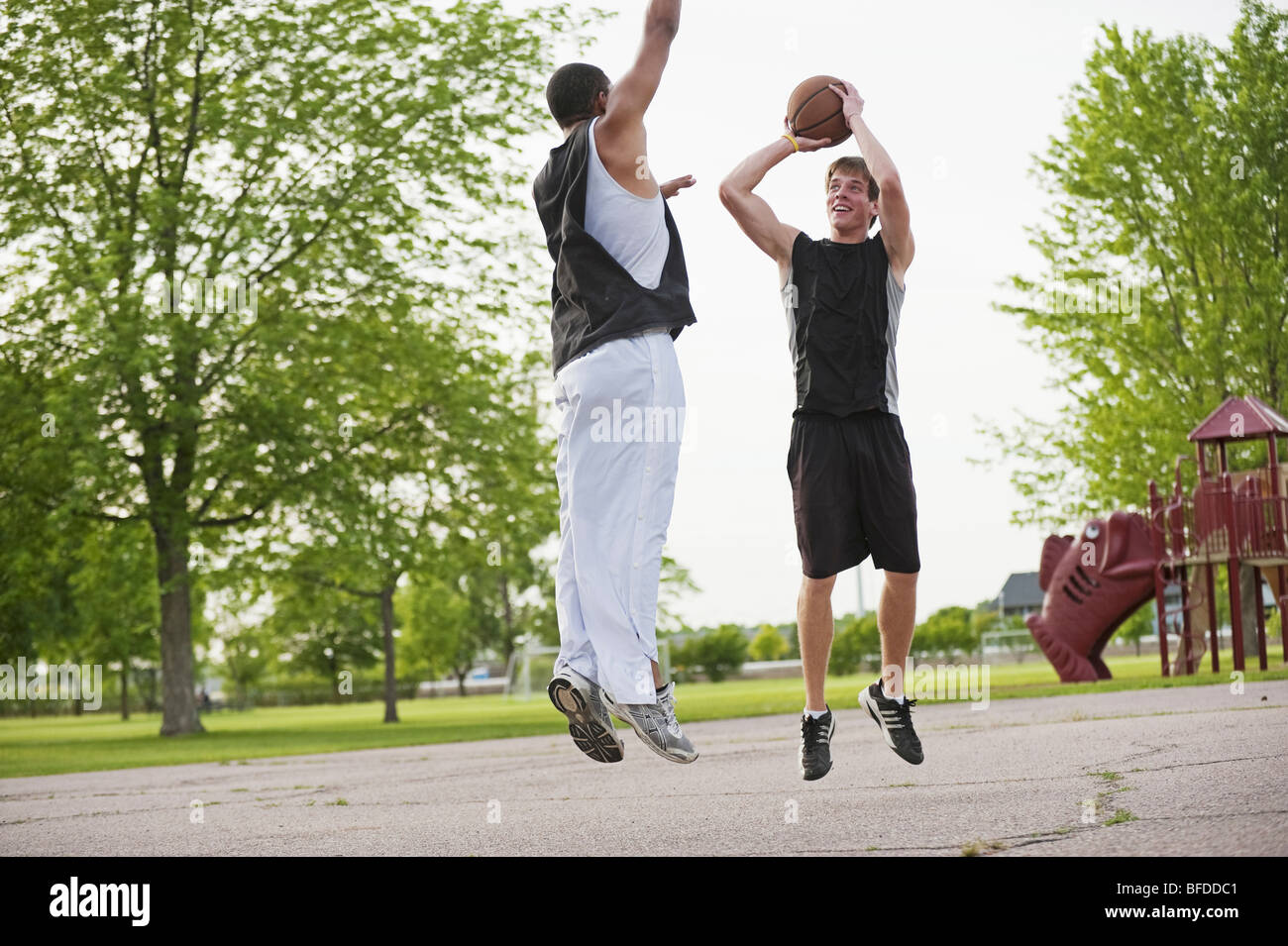 Two young men play one on one Basketball at Barstow Park in Vermillion ...