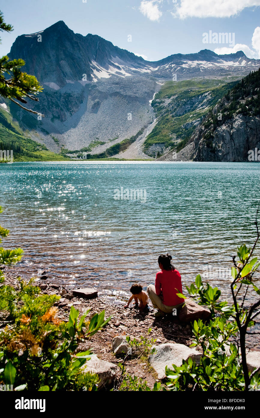 A mother & 14 month old son play on shore of Snowmass Lake (10,980ft ...