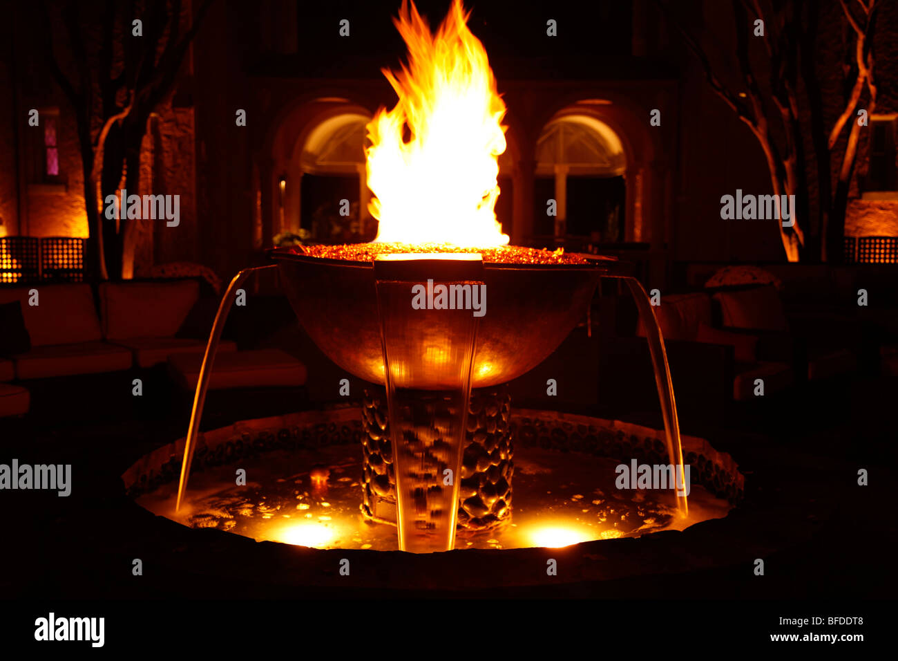 A fountain of fire with flowing water Stock Photo - Alamy