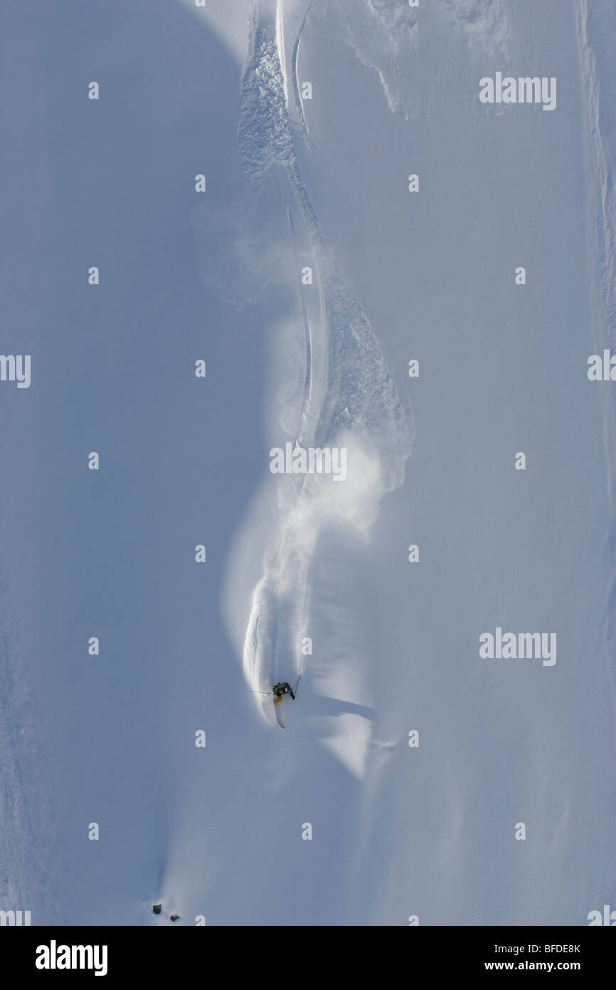 Skier shot from above making powder turns in the Tordillo Mountains ...