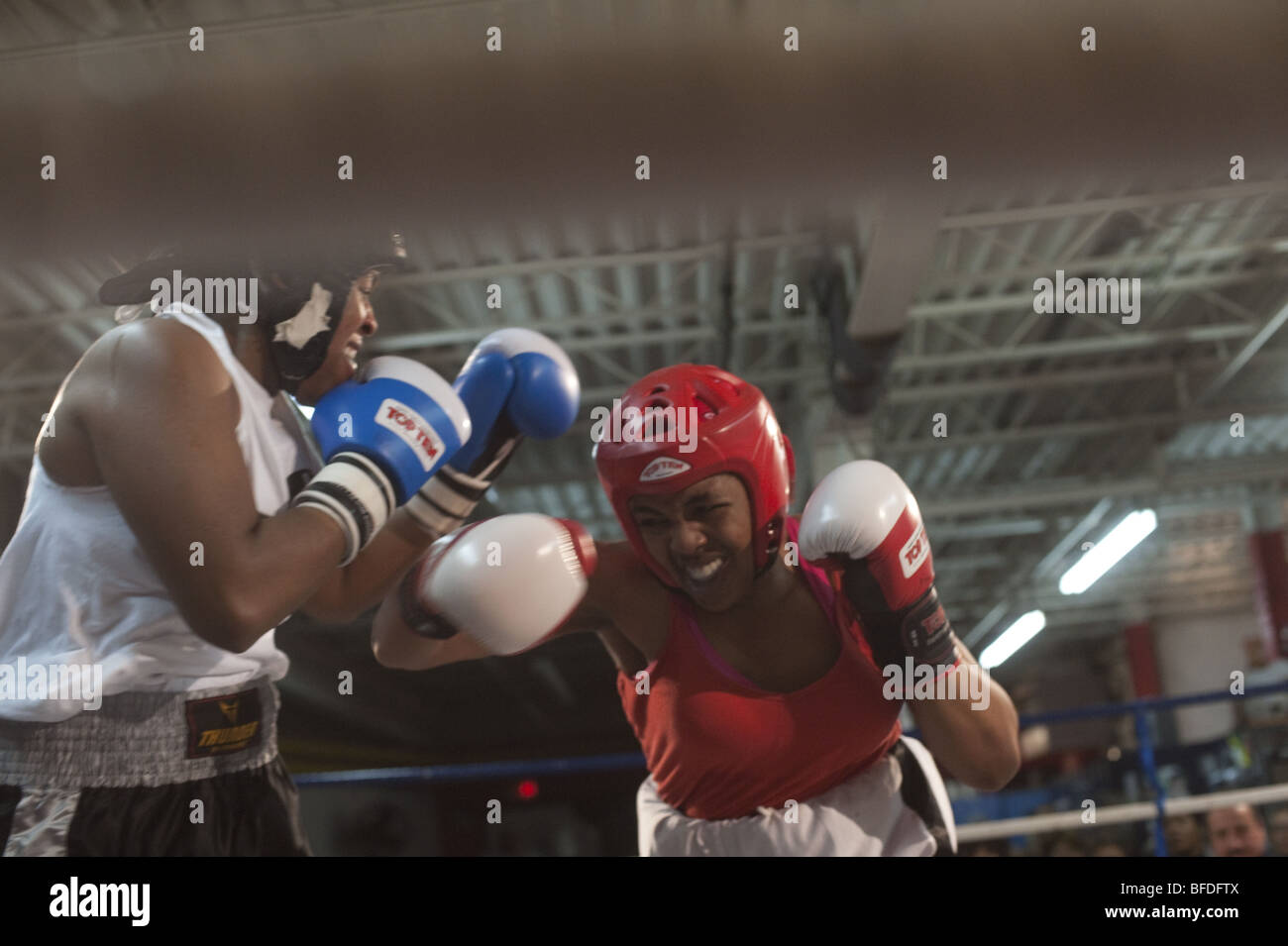 Female boxers battle during fight at the Toronto Newsgirls boxing gym ...