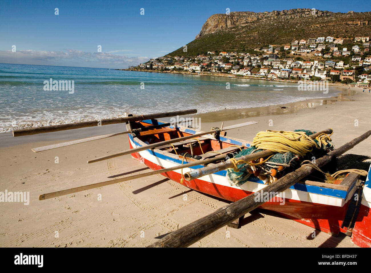A traditional fishing boat awaits to set sail from Fish Hoek Beach on ...
