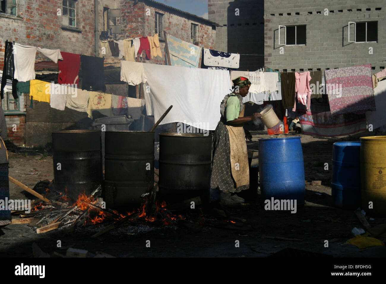 A woman does her washing in Langa Township, Cape Town, South Africa ...