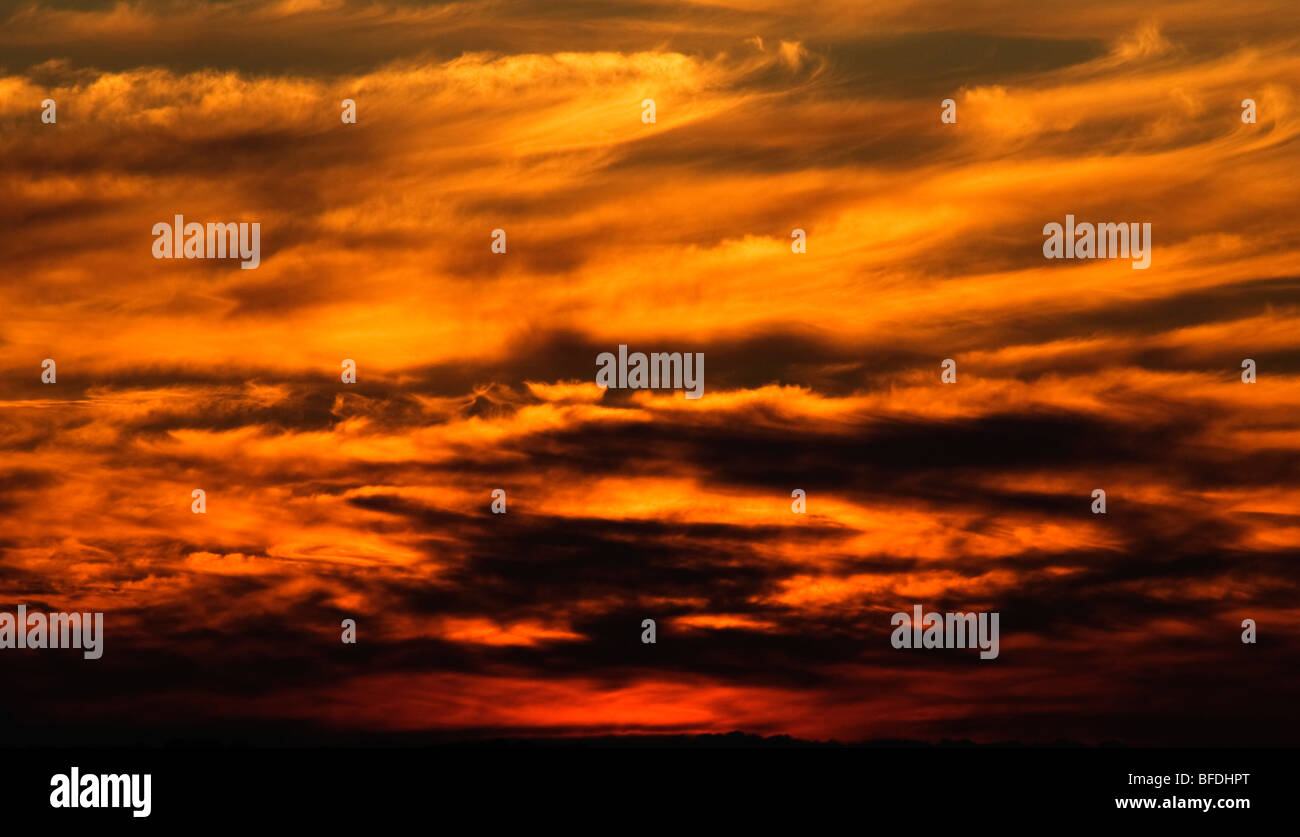 Fiery red cloud abstract at sunset, Devon UK Stock Photo - Alamy
