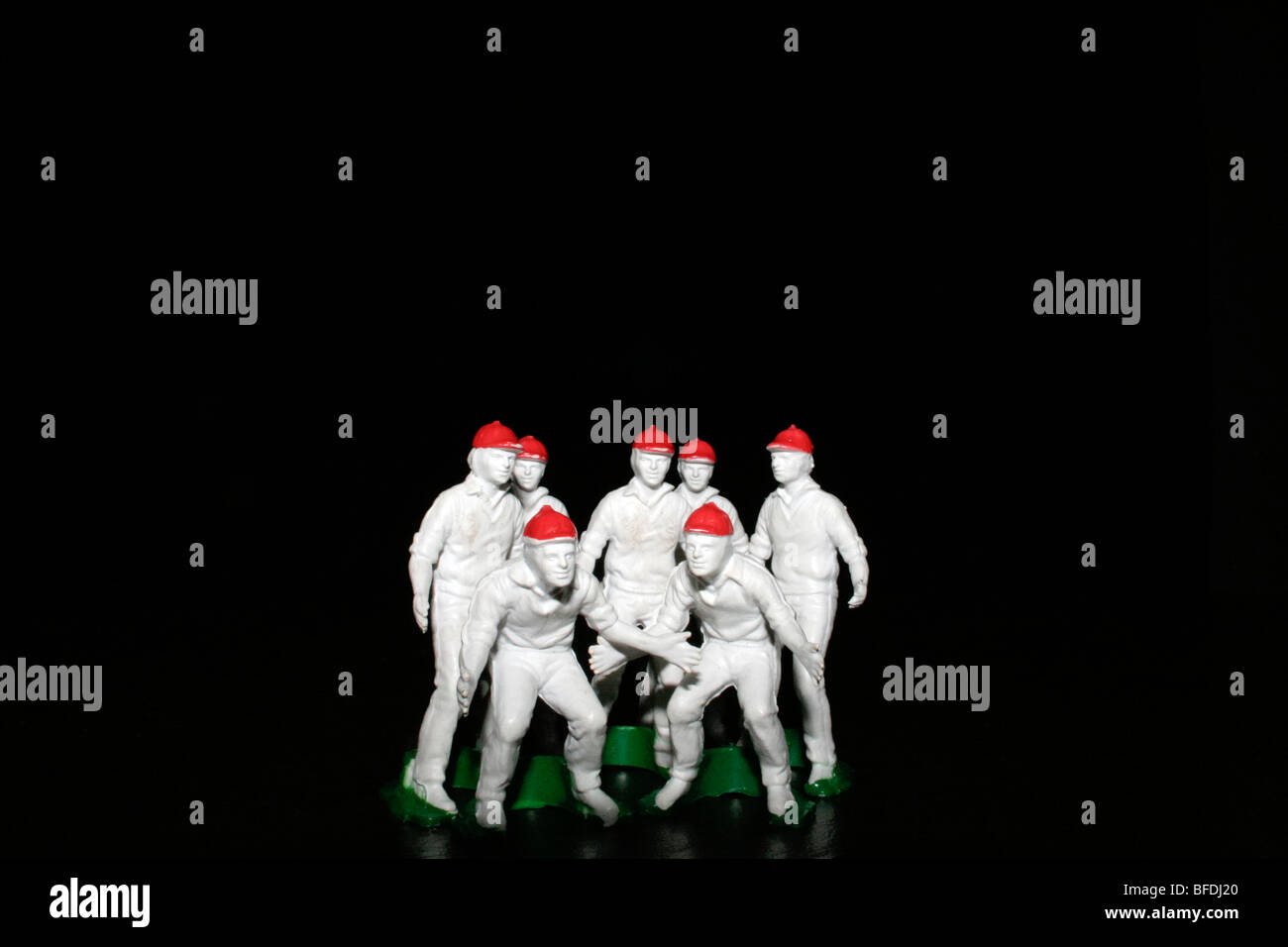 Toy men playing cricket on black background Stock Photo - Alamy