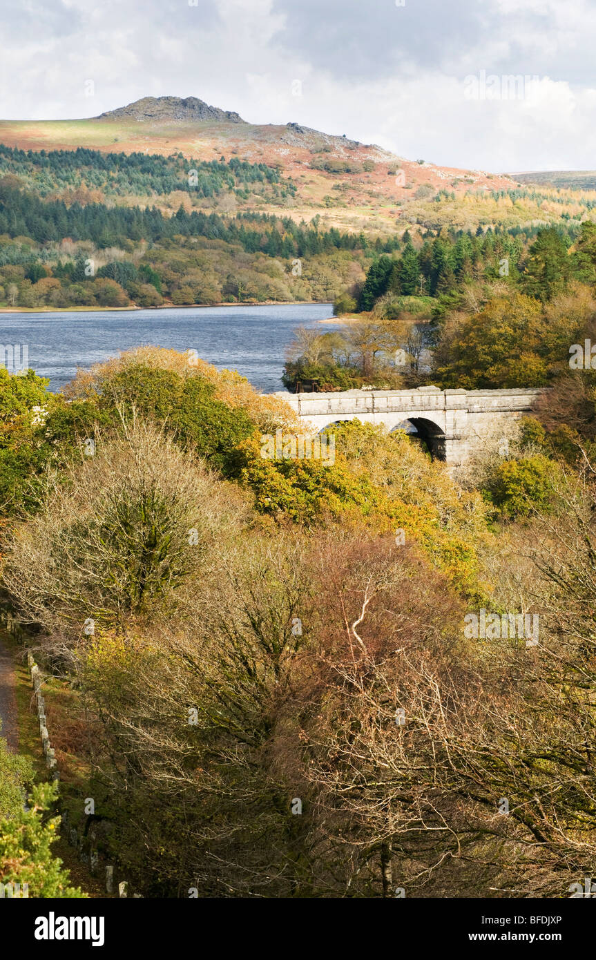 Burrator Reservoir dam and water with autumnal trees in foreground and ...