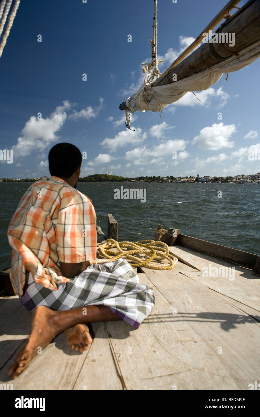 Man on Dhow Sailing - Lamu Island, Kenya Stock Photo - Alamy