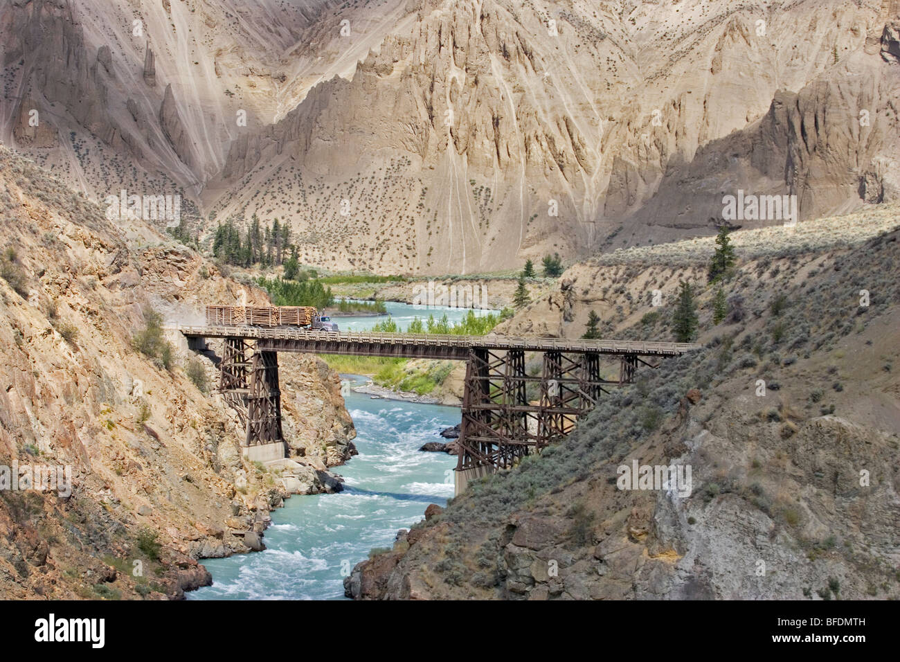 Logging truck crosses the Chilcotin River at Farwell Canyon, British ...