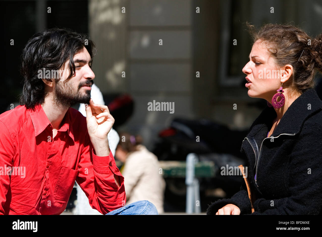 French man and woman have a conversation near the Sorbonne in Paris ...