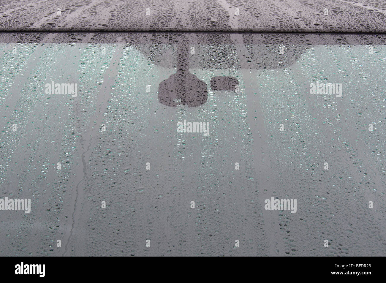 Car windshield with automatic wiper sensor and rain on the glass Stock ...