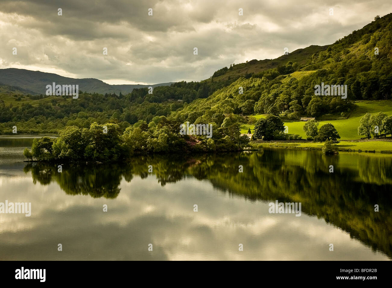 Rydal Water with a perfect reflection of trees and hills in the Lake ...