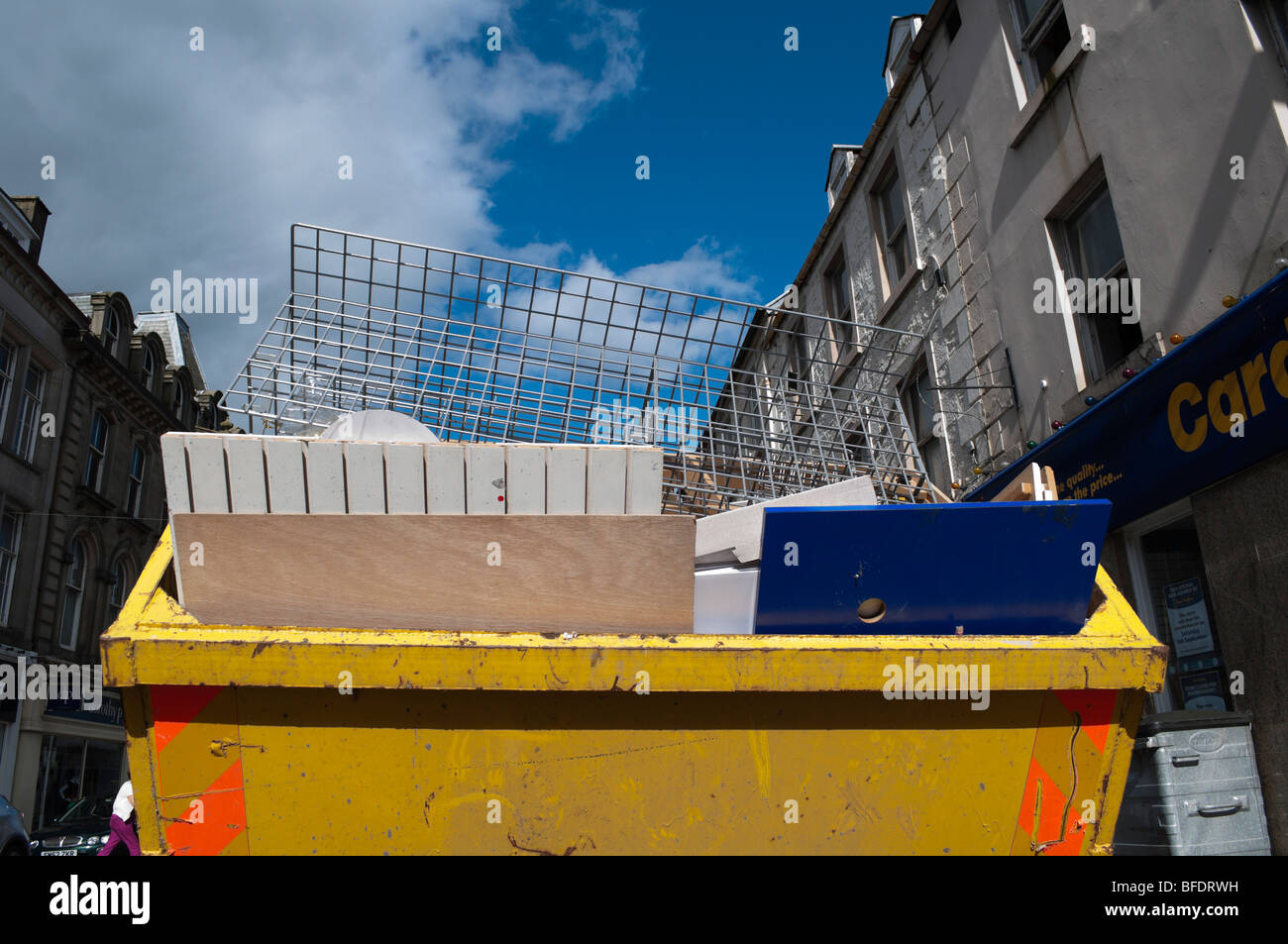 Waste skip in Scottish town of Hawick with shopfittings thrown away ...