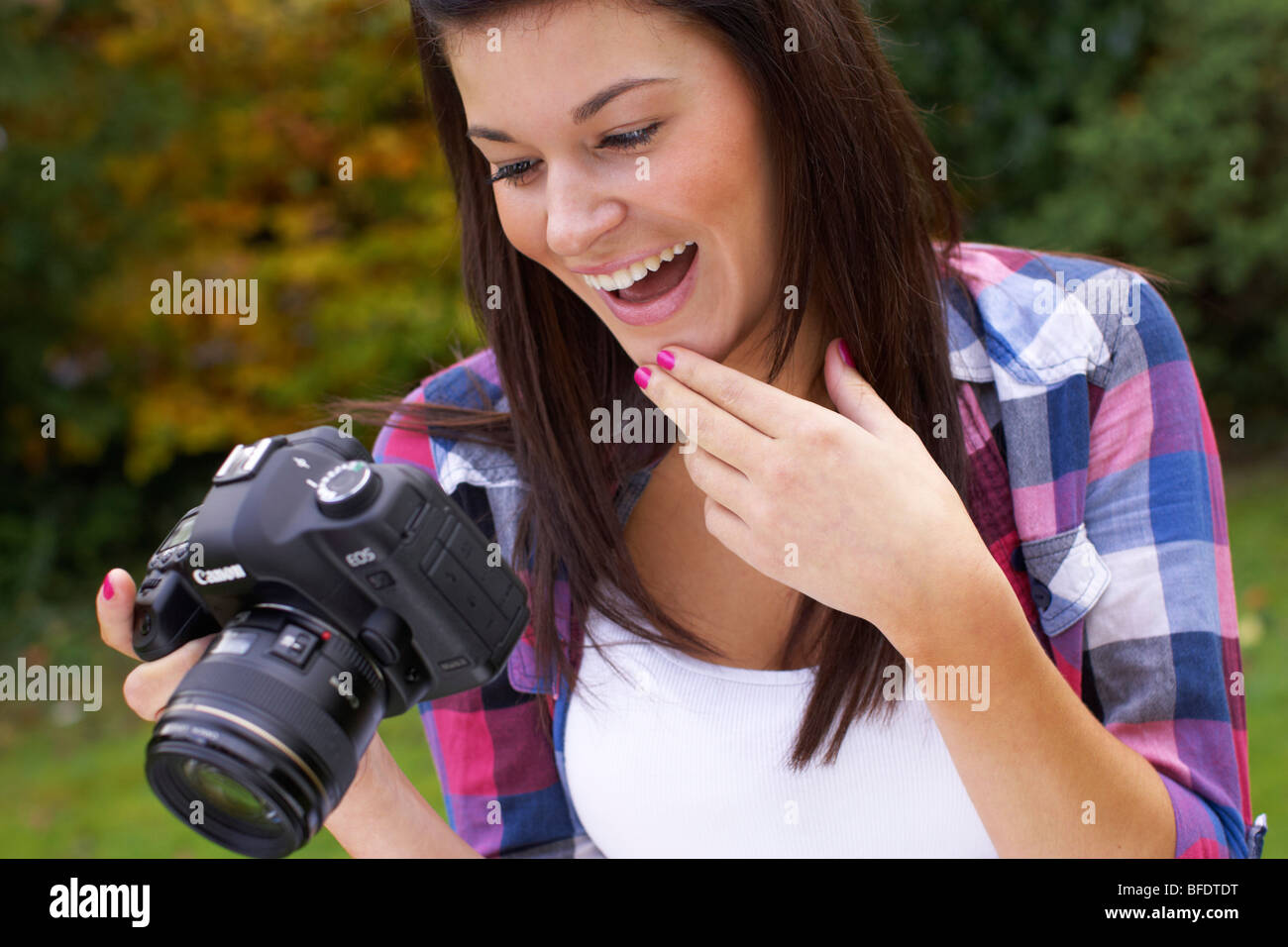 Girl with camera Stock Photo - Alamy