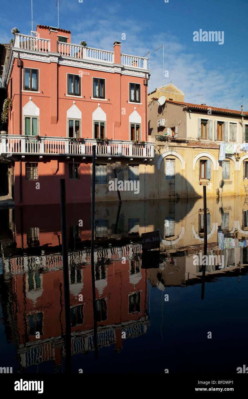 Venetian style houses reflected in the Vena canal in Chioggia, Veneto ...