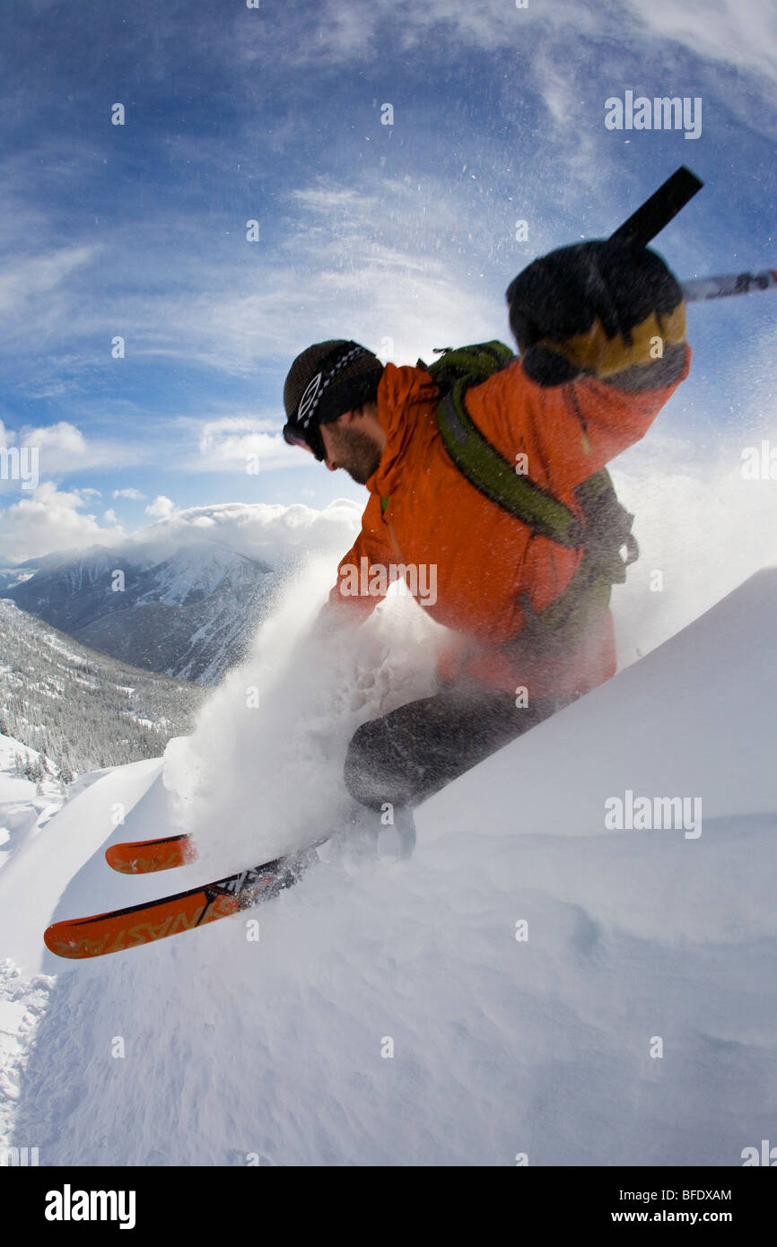 A skier making some nice turns in the powder in the backcountry of ...