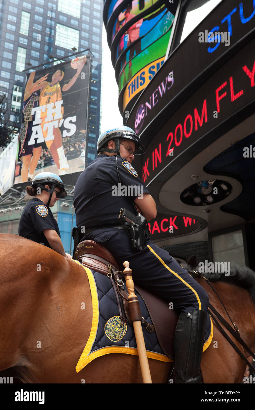 Female police officers sitting on horseback, Times Square, New York ...