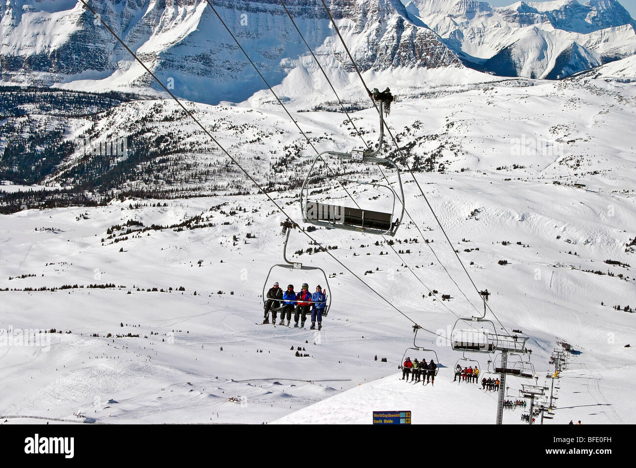 Skiers in chairlifts at Sunshine Ski Resort, seen from top of the main ...