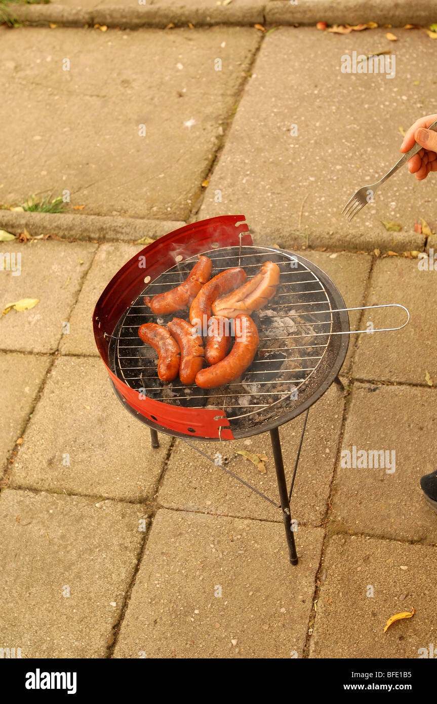 Polish sausages on small grill hi-res stock photography and images - Alamy