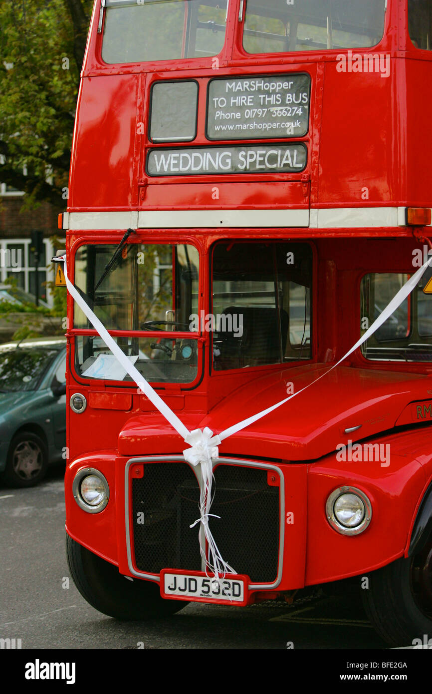 Red double decker Routemaster buses used for weddings to ferry guests ...