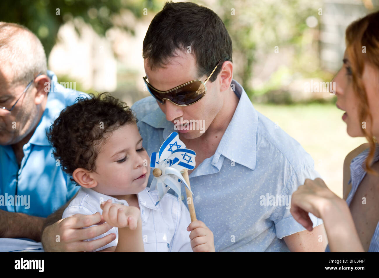 Young boy holding national flags Stock Photo - Alamy