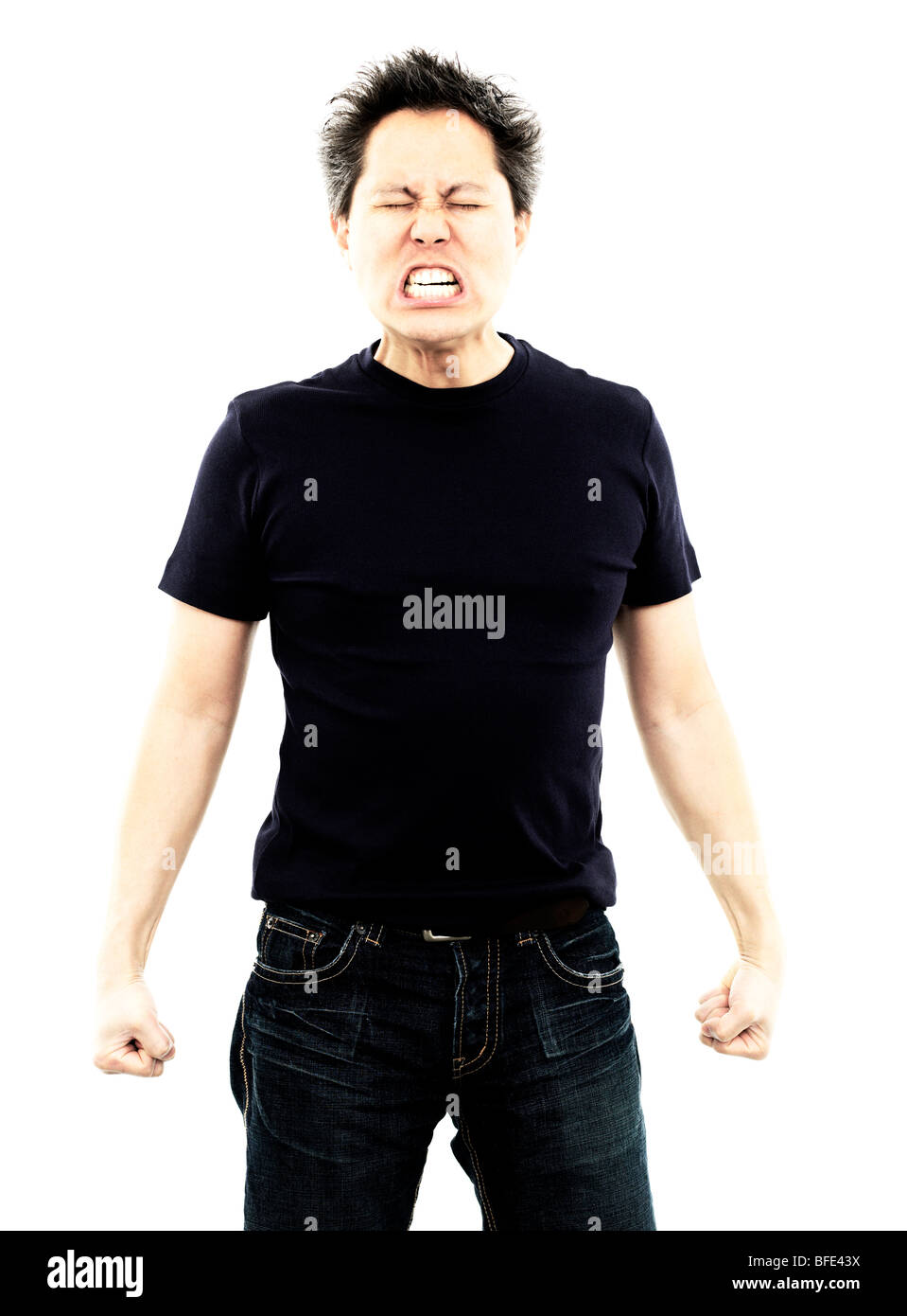 44 year old Asian male wearing jeans and a blue t-shirt standing ...