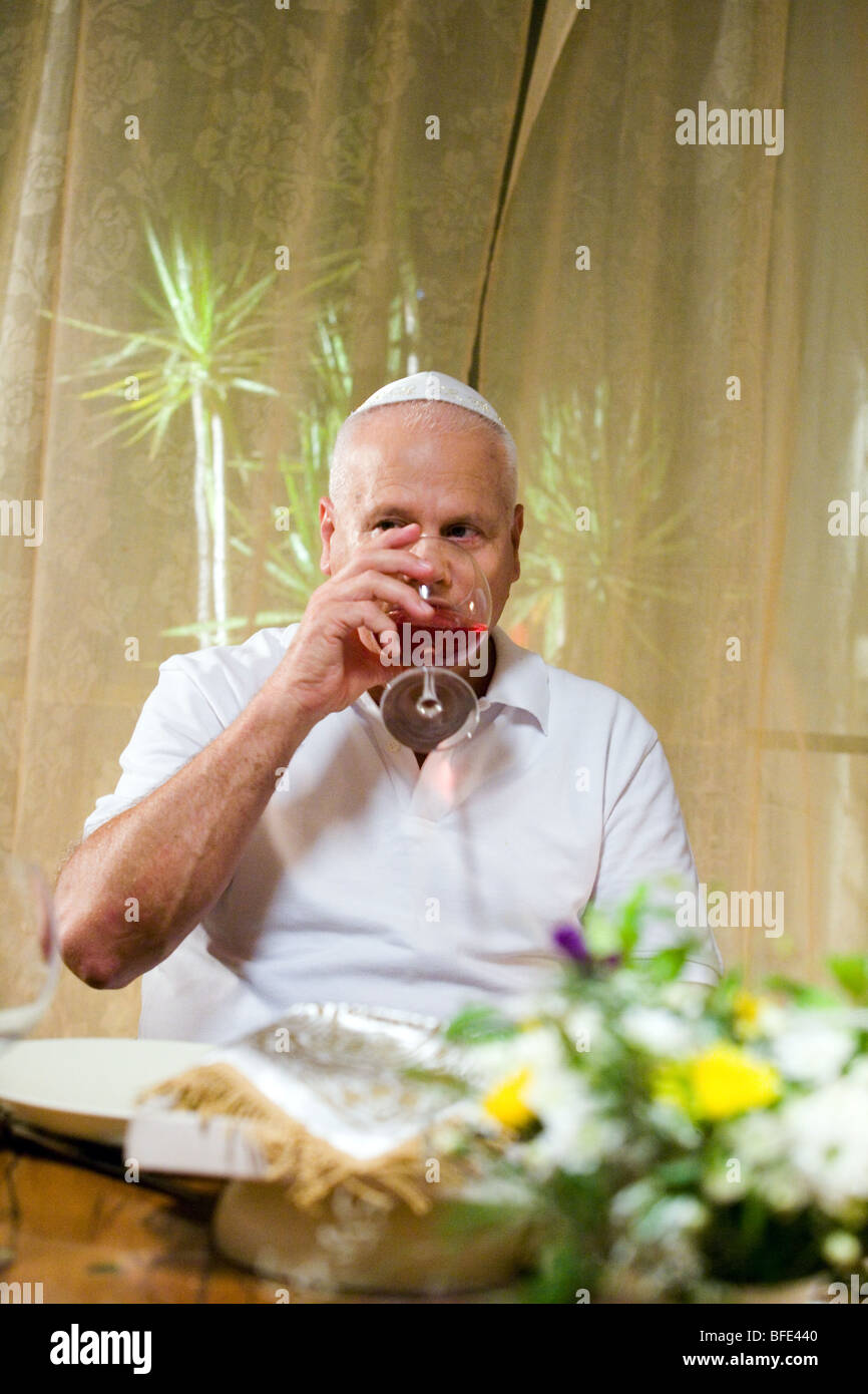 Elder man drinking blessed wine at Seder Night Stock Photo - Alamy