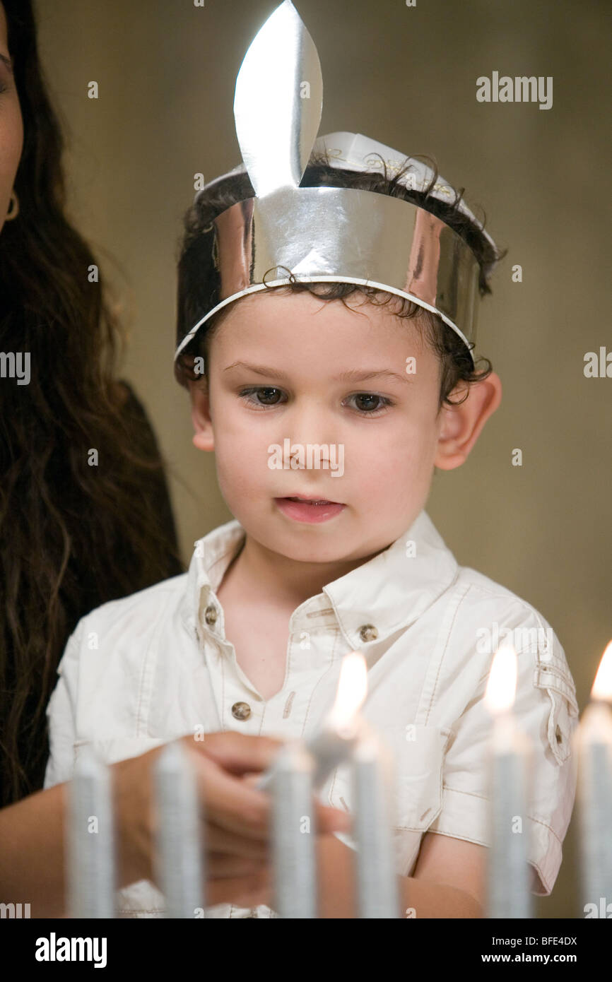 Hand child lights candle hi-res stock photography and images - Alamy