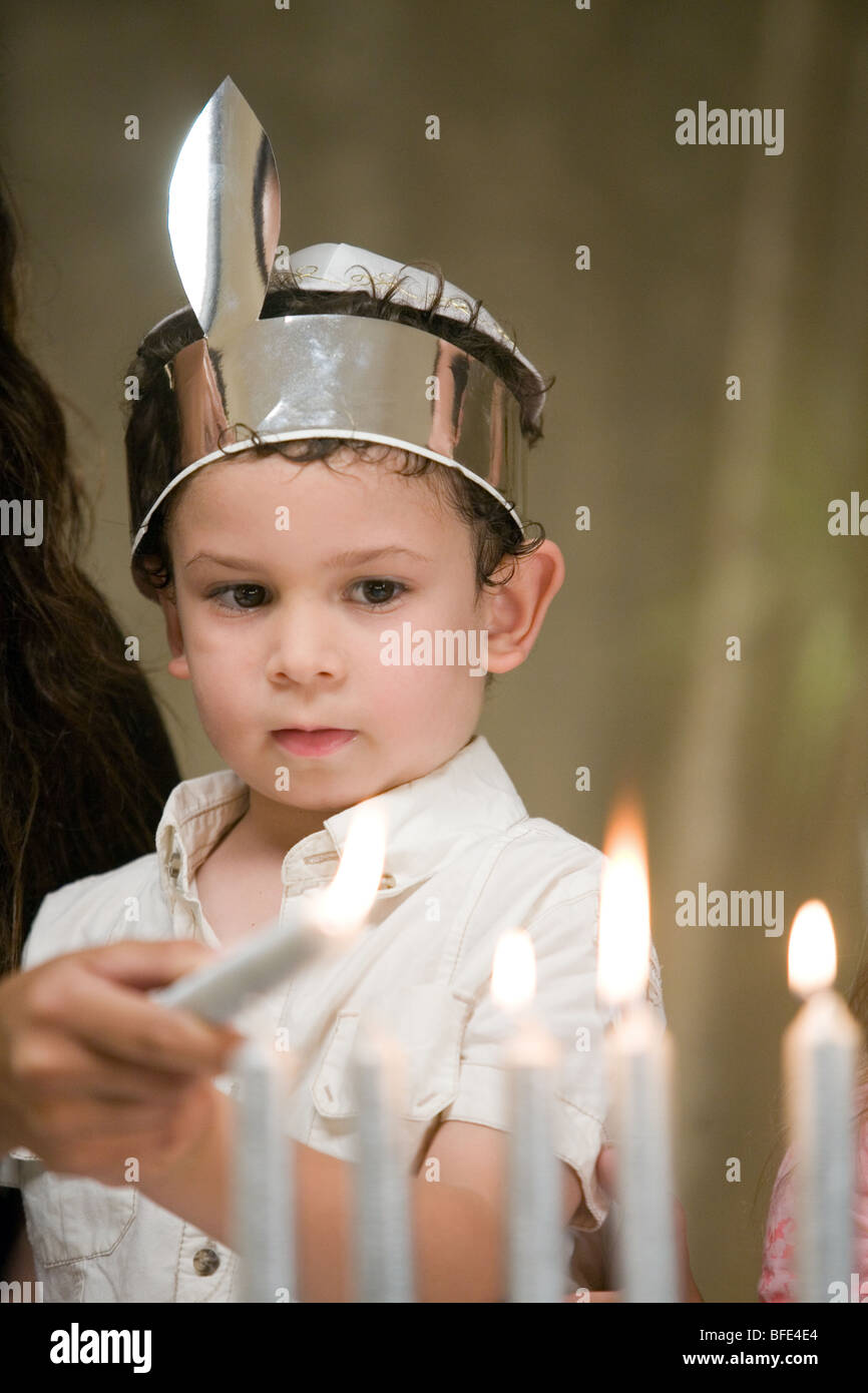 Hand child lights candle hi-res stock photography and images - Alamy