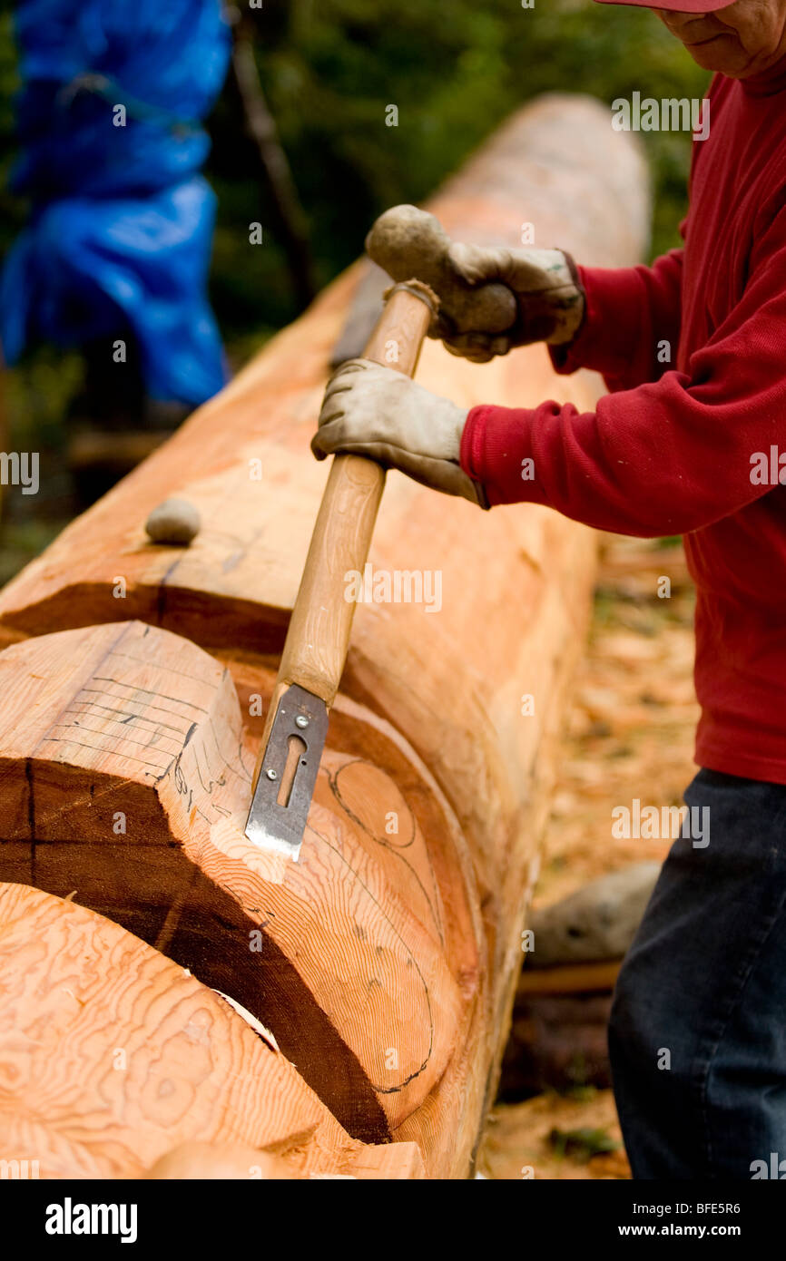 A member of First Nations band in Fort Rupert carves into a memorial ...