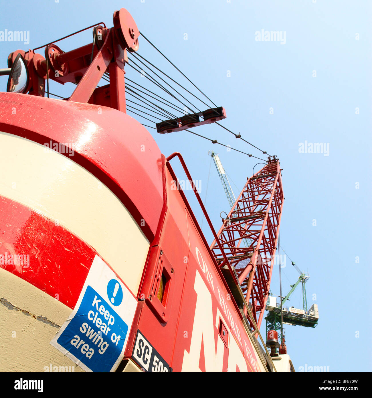 Abstract view of a mobile crane with safety sign Stock Photo - Alamy