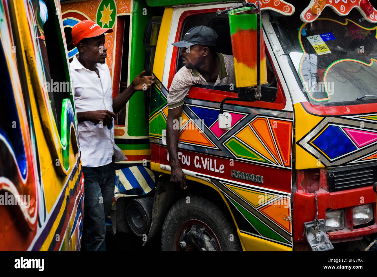 The tap-tap bus driver maneuvering his vehicle in heavy traffic of Port ...