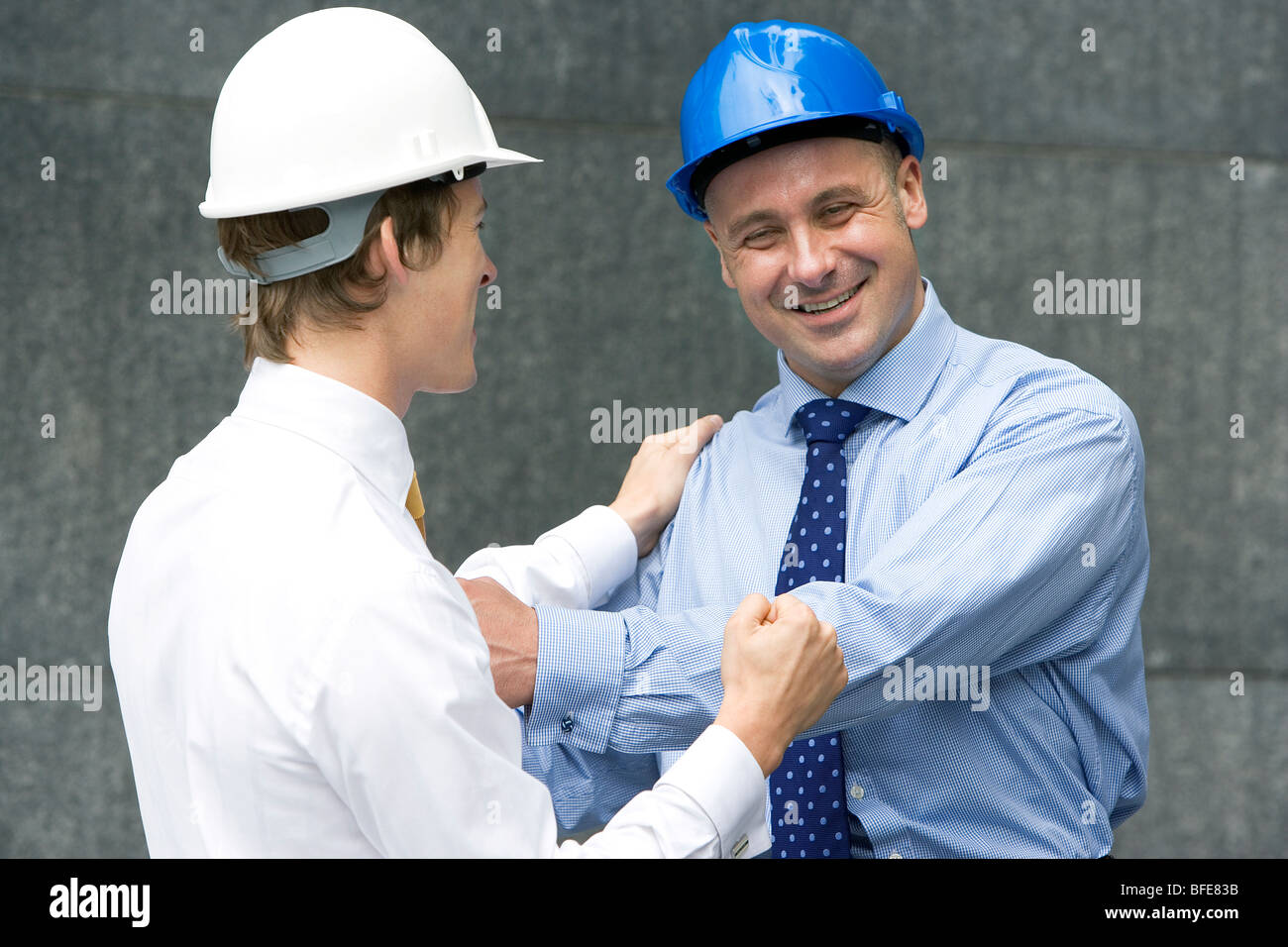 Teamwork. Construction managers Stock Photo - Alamy