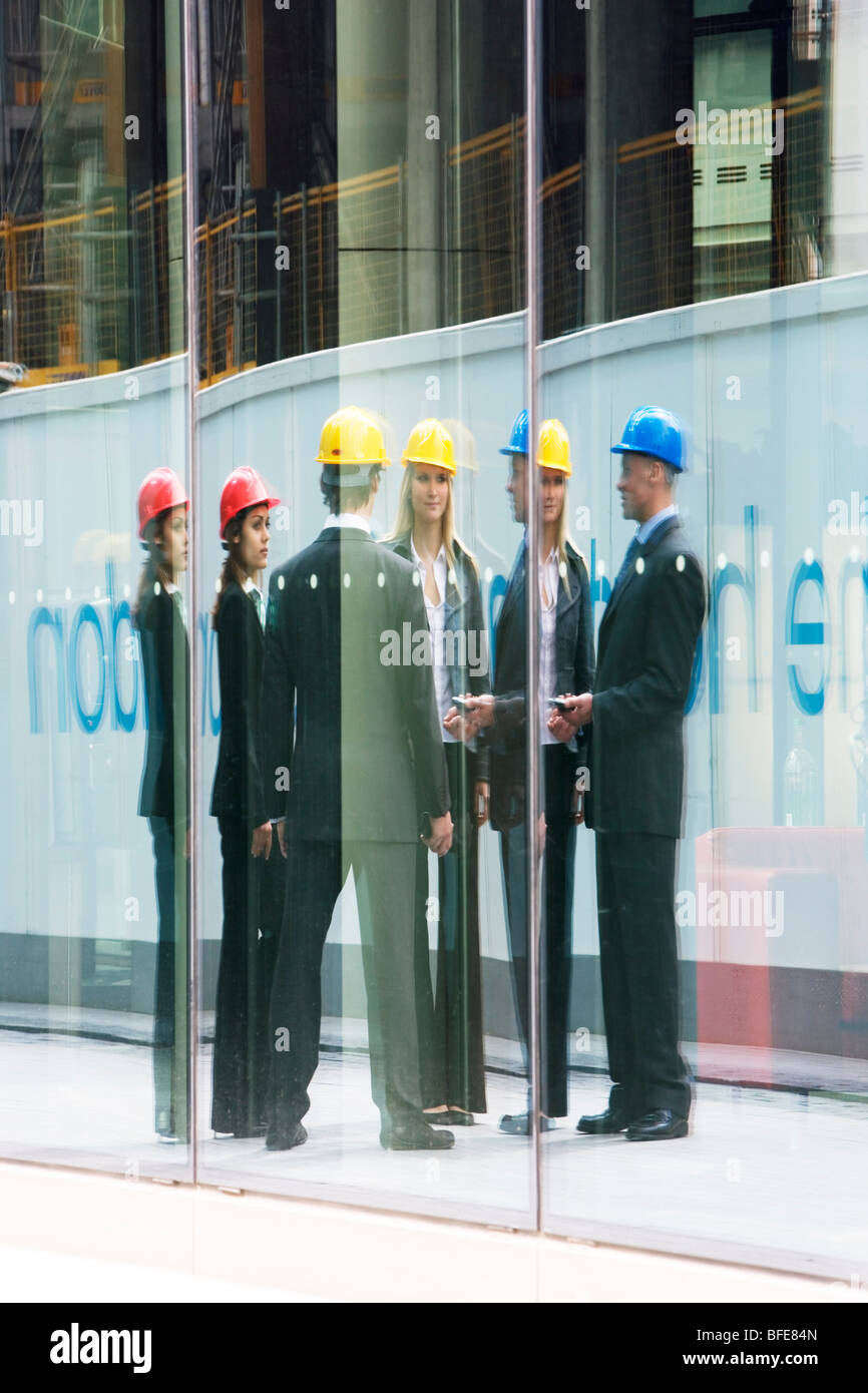 Team of construction managers visiting a property development Stock ...