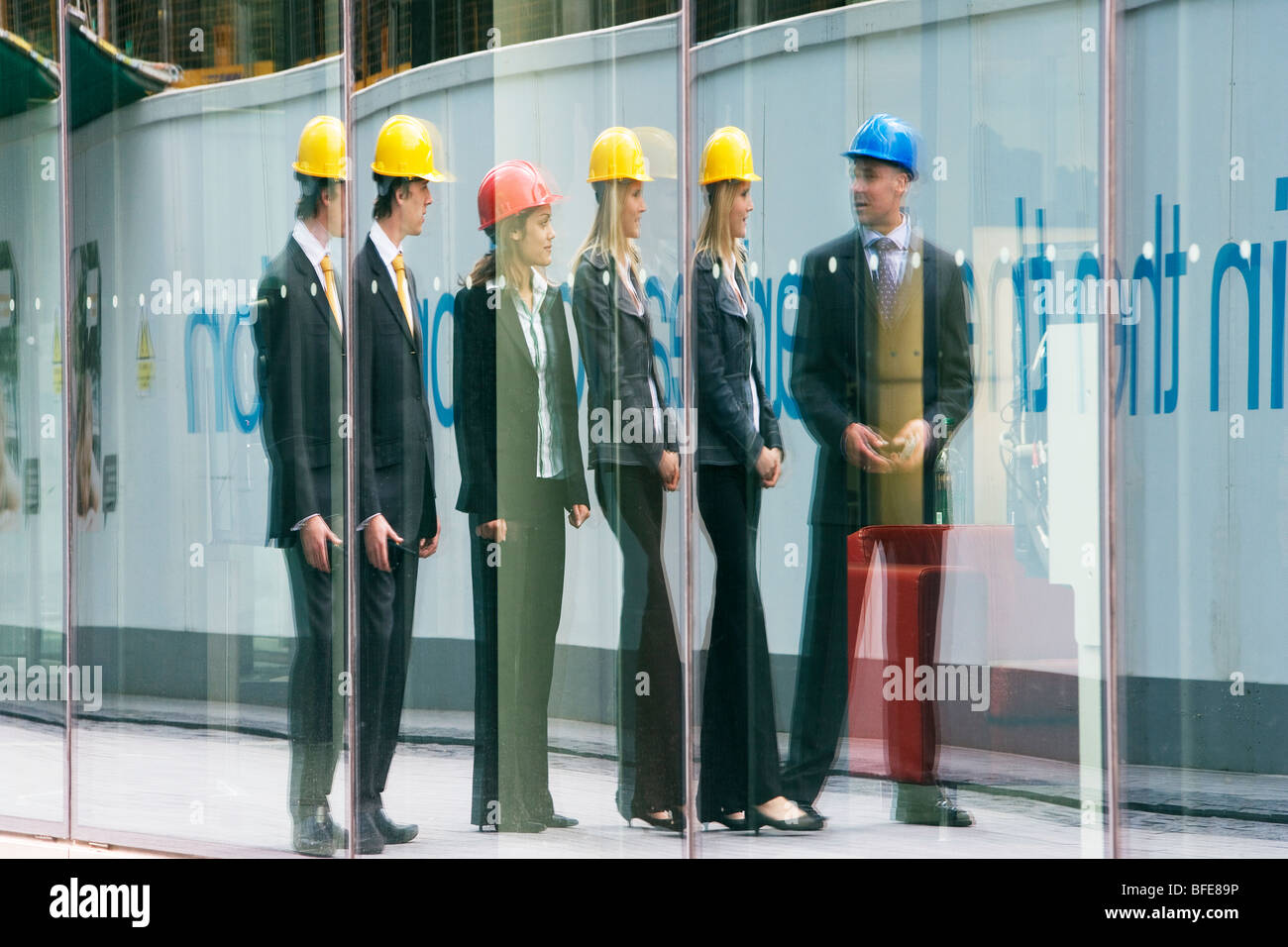 Team of construction managers visiting a property development Stock ...