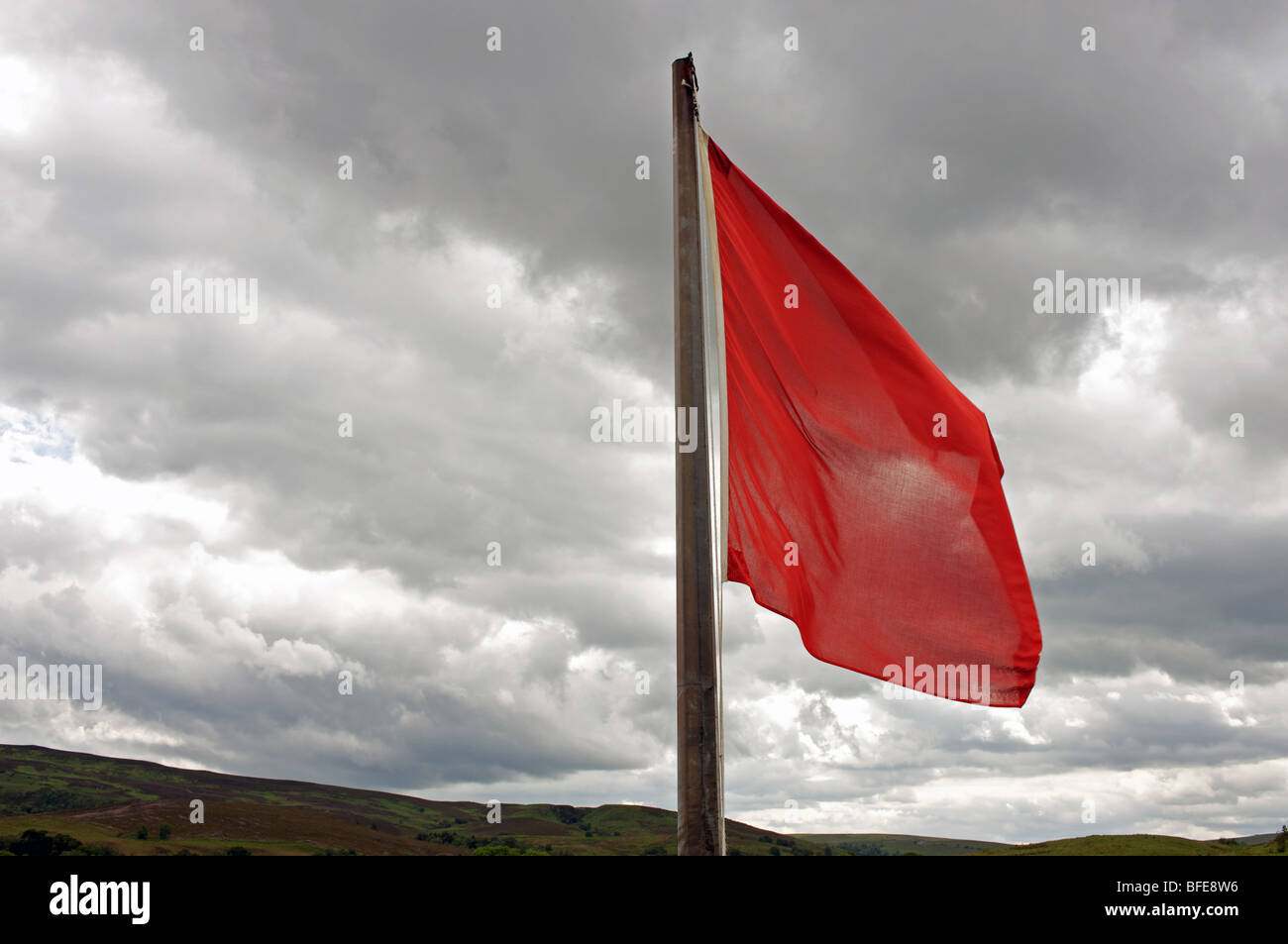 Red flag warning sign on a military firing range Stock Photo - Alamy
