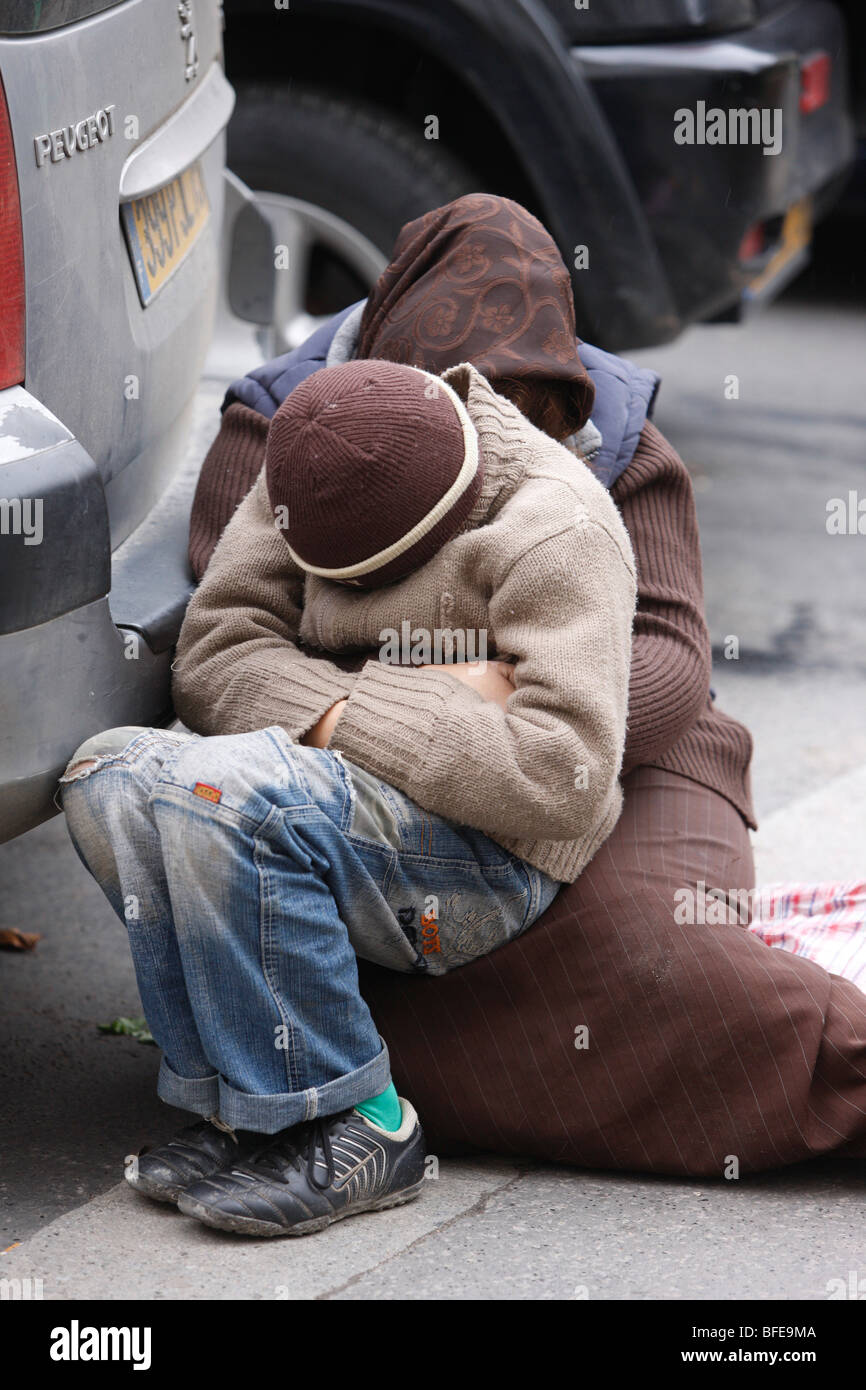 France Paris Homeless boy and woman in a street of Paris Stock Photo ...