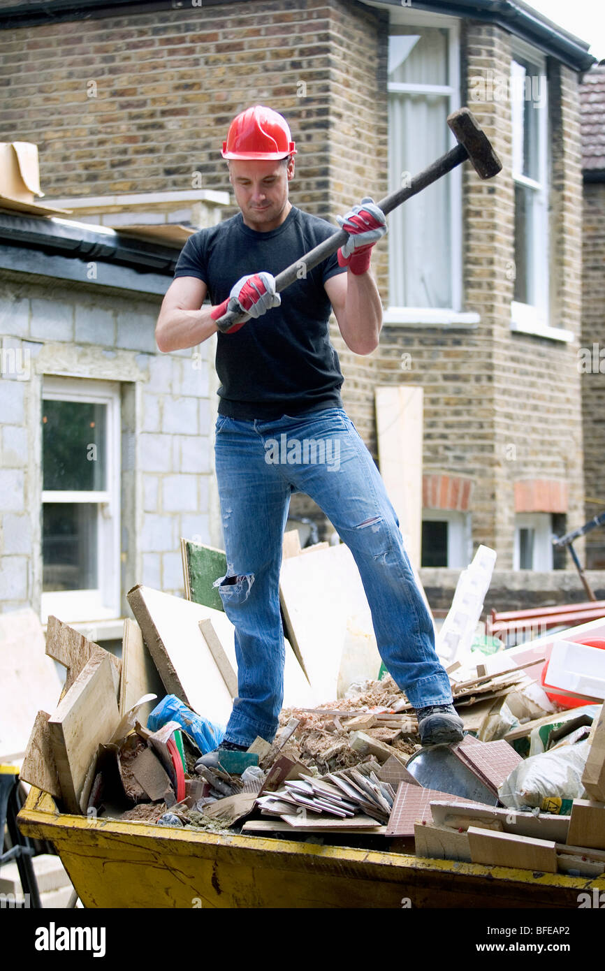 Builder with sledge hammer Stock Photo - Alamy