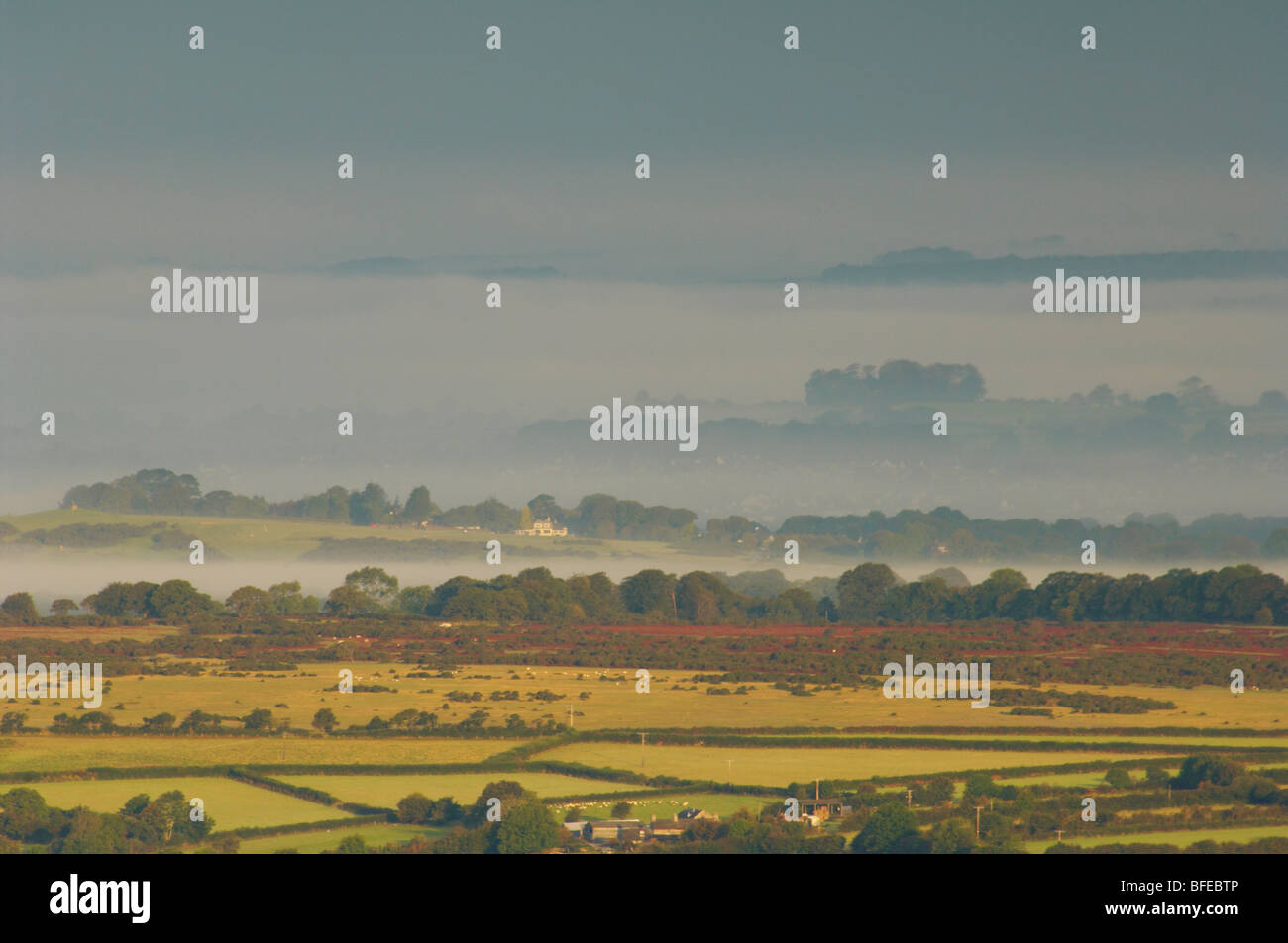 Early morning mist fills the valley at Dousland on Dartmoor Devon UK ...