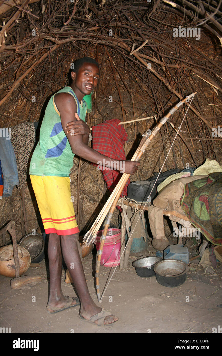 Hadza Tribe Man With Hunting Bow Inside His Home, Taken near Yaeda ...