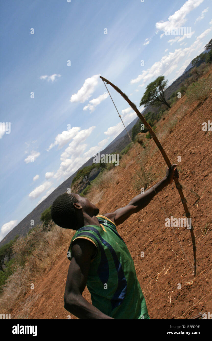 Hadza Tribe Man Fires Arrow From Hunting Bow, Taken near Yaeda Chini ...